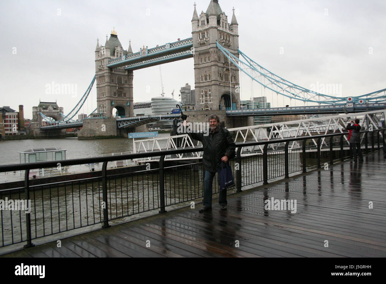 london england wet thames river water man clouds dark rain raining 584 ...