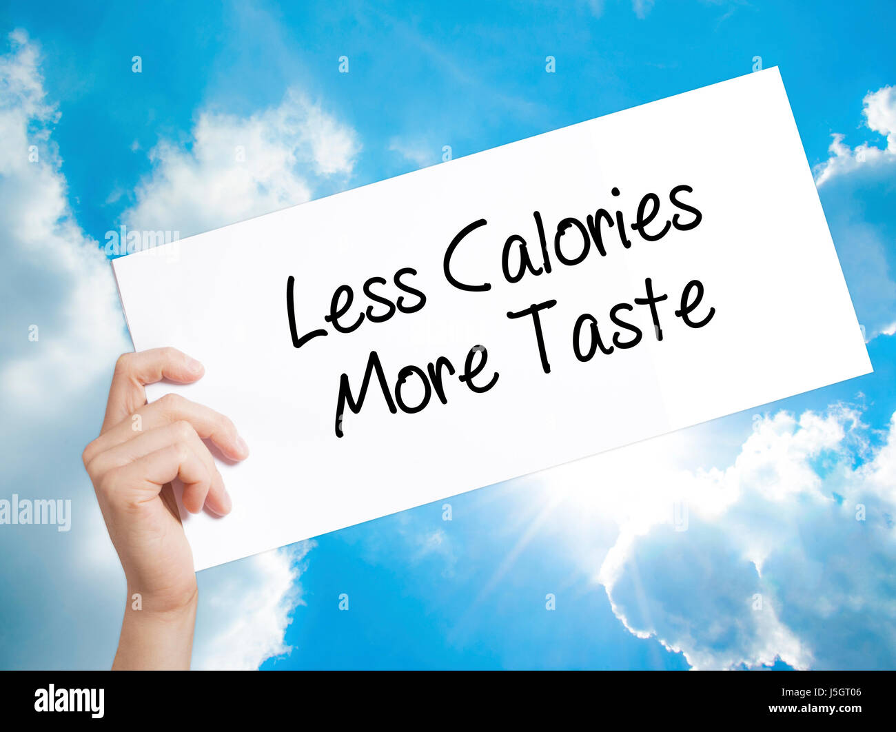 Less Calories More Taste Sign on white paper. Man Hand Holding Paper ...
