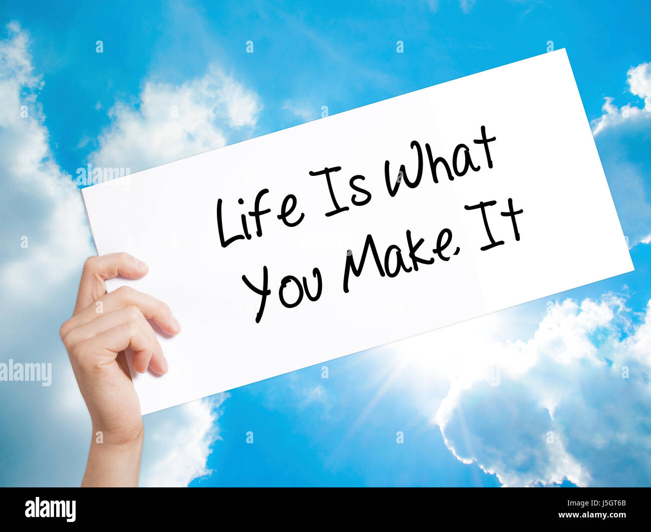 Life Is What You Make It Sign on white paper. Man Hand Holding Paper ...
