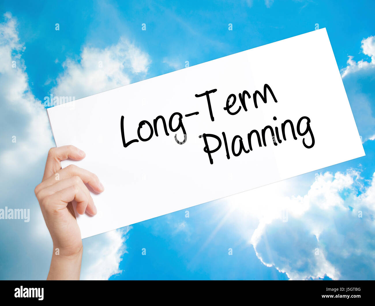 Long-Term Planning Sign on white paper. Man Hand Holding Paper with ...