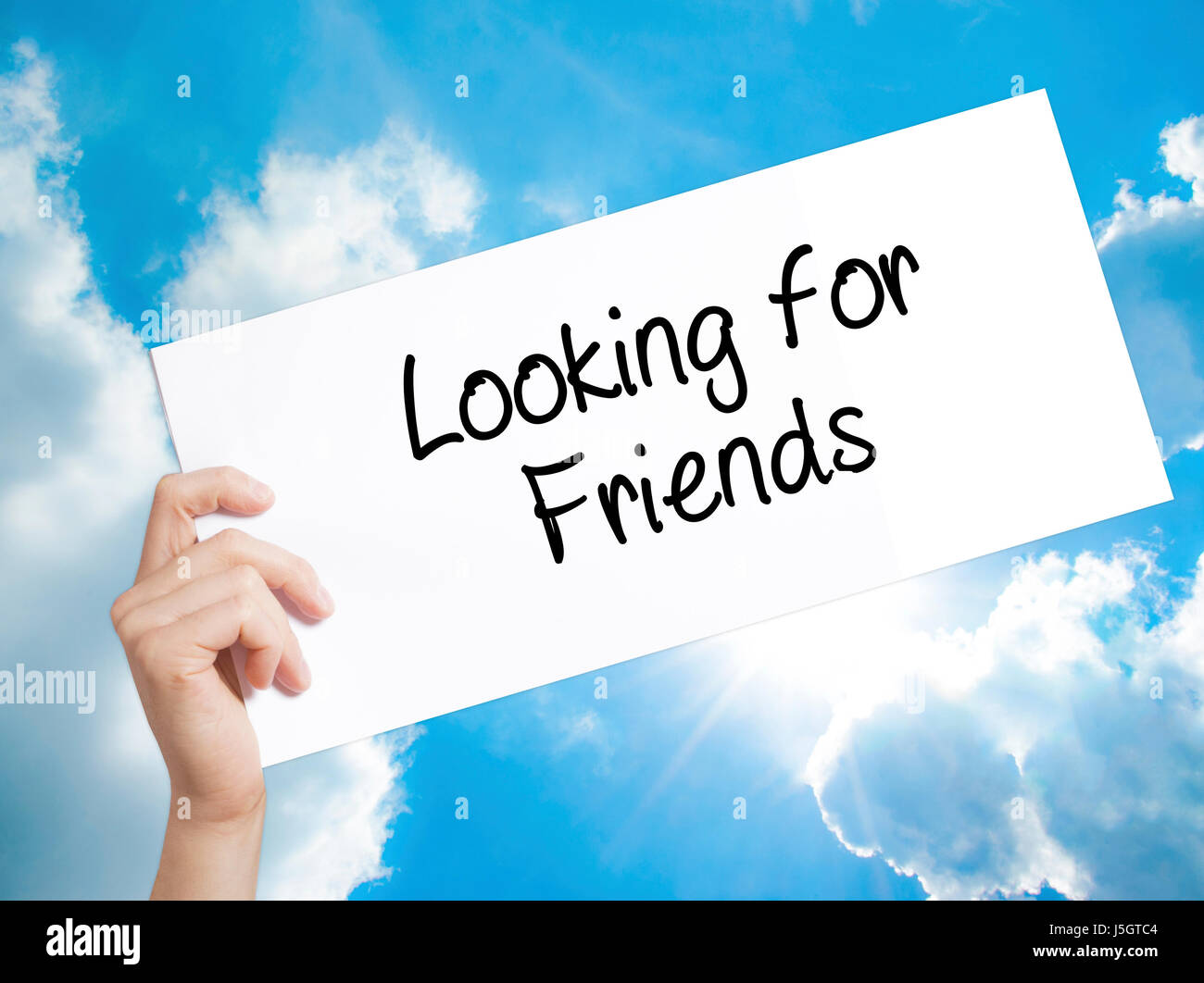 Looking for Friends Sign on white paper. Man Hand Holding Paper with ...