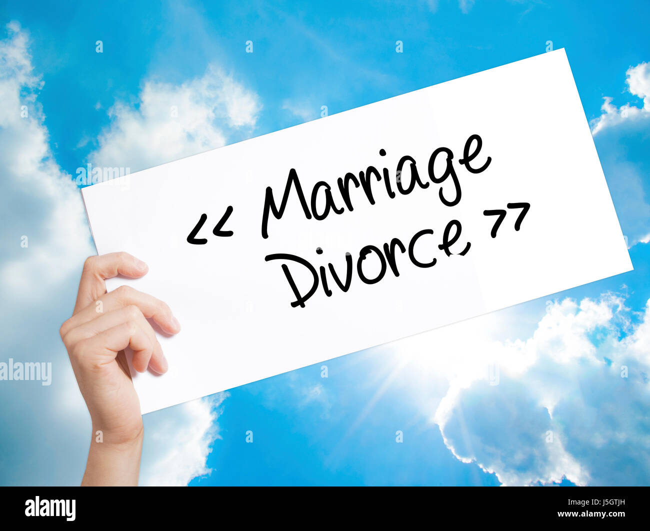Marriage - Divorce Sign on white paper. Man Hand Holding Paper with ...