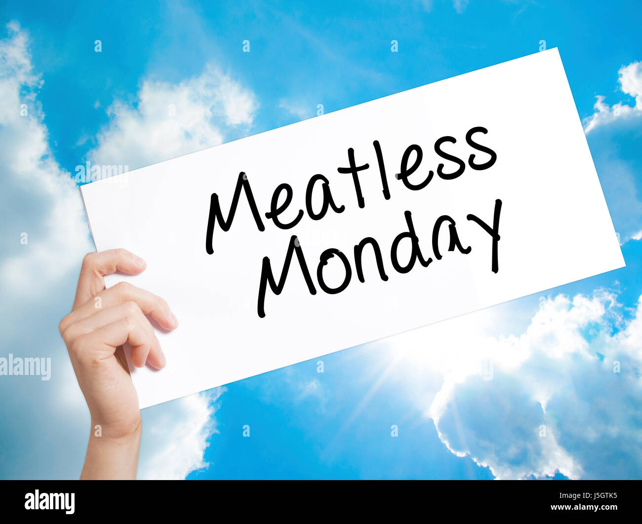 Meatless Monday Sign on white paper. Man Hand Holding Paper with text ...