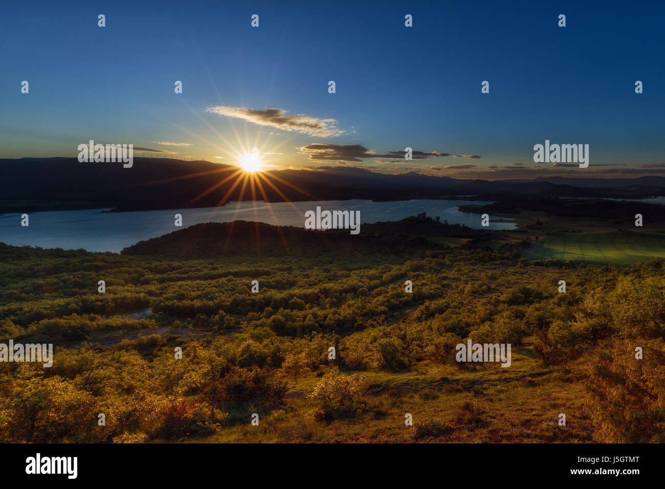 Sun rays over the lake Stock Photo - Alamy