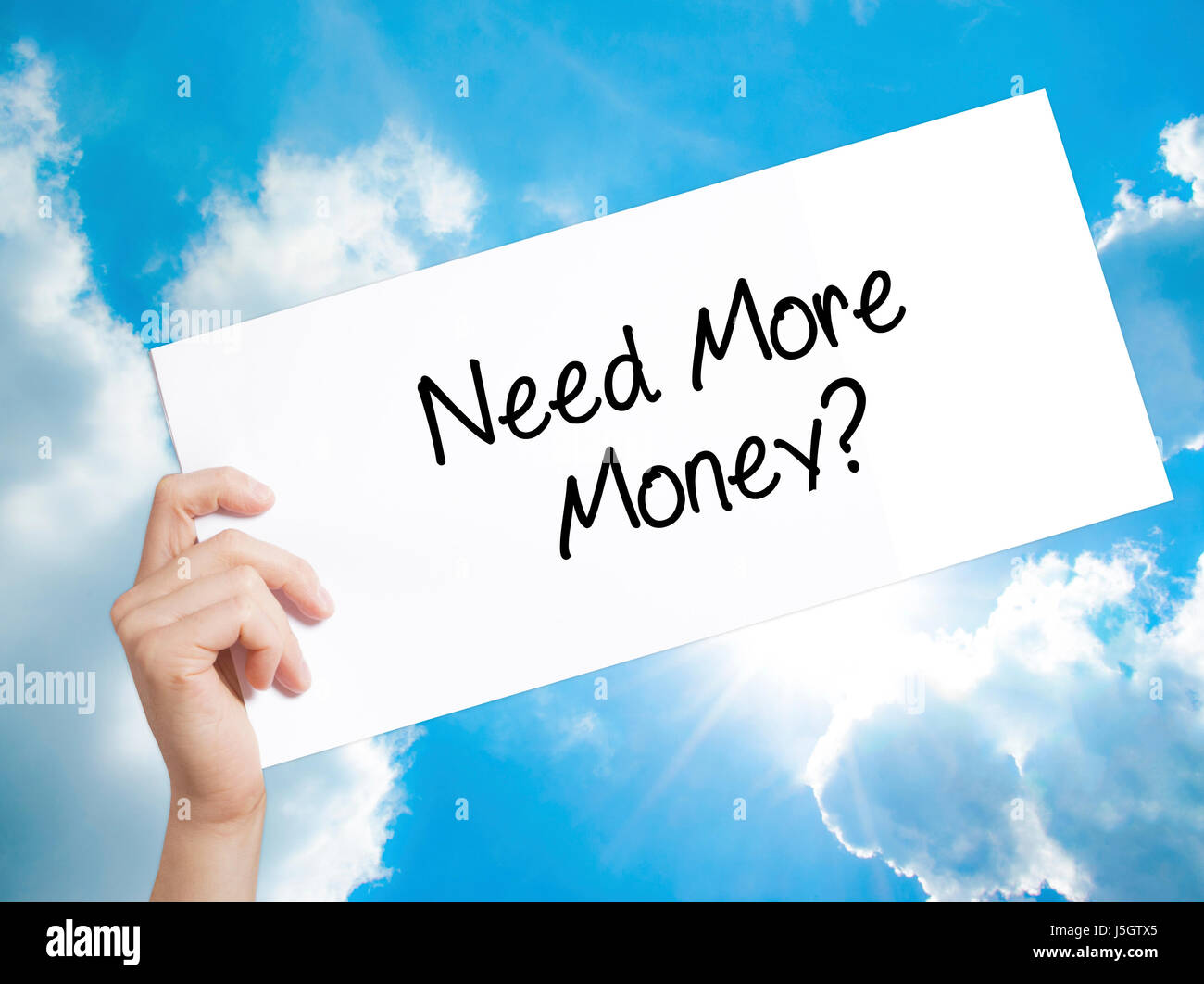 Need More Money? Sign on white paper. Man Hand Holding Paper with text ...