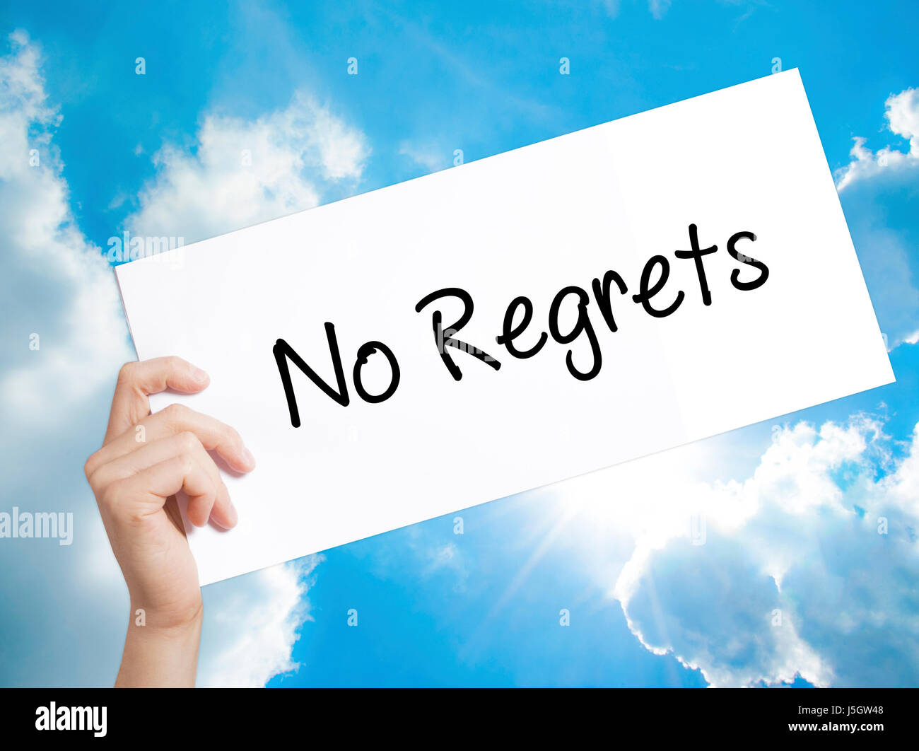 No Regrets Sign on white paper. Man Hand Holding Paper with text ...