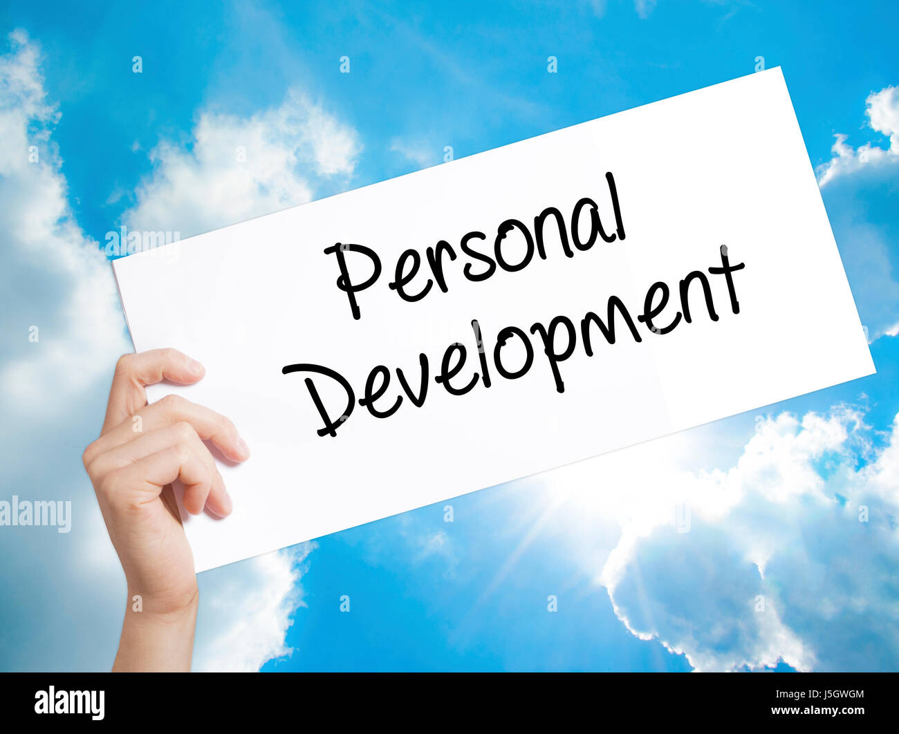 Personal Development Sign on white paper. Man Hand Holding Paper with ...