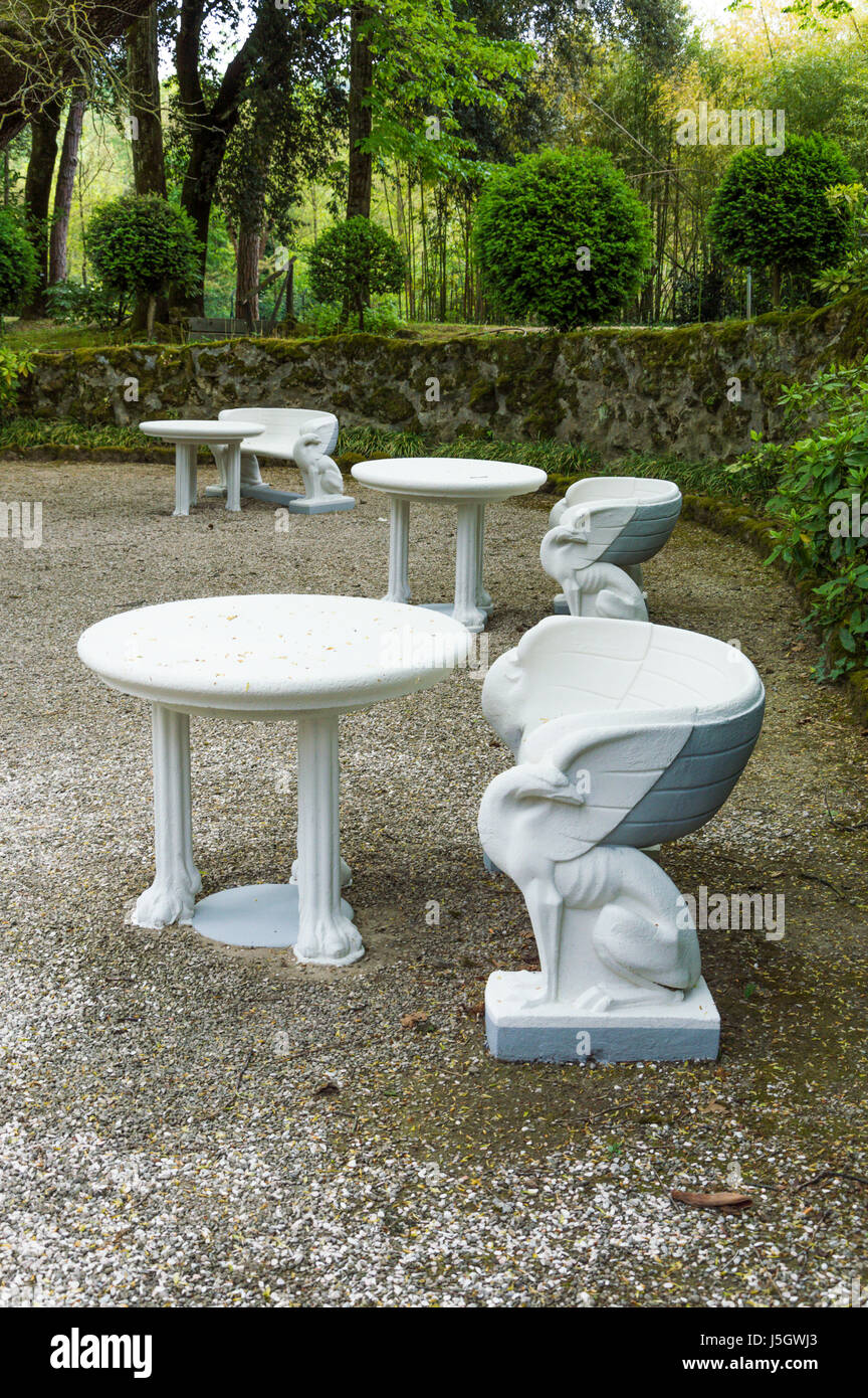 White stone benches with sculpted griffin shape, architecture of 900's ...