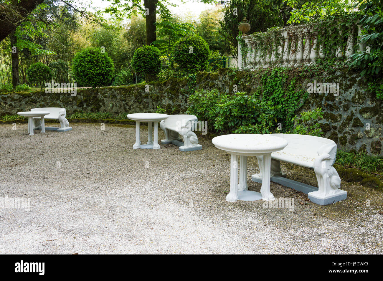 White stone benches with sculpted griffin shape, architecture of 900's ...