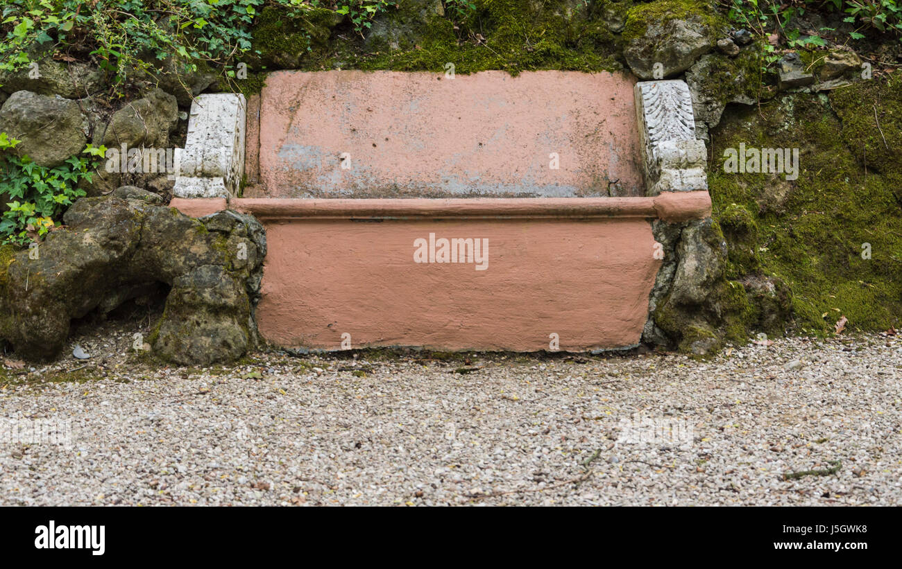 Ancient brown stone bench stuck in the rock Stock Photo - Alamy