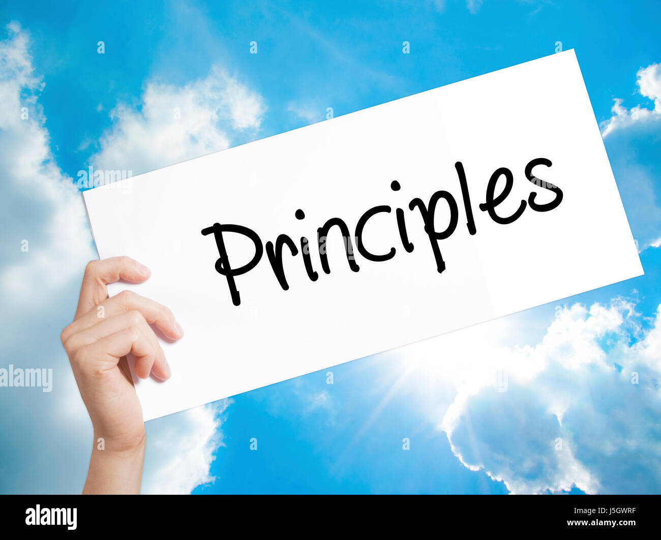 Principles Sign on white paper. Man Hand Holding Paper with text ...