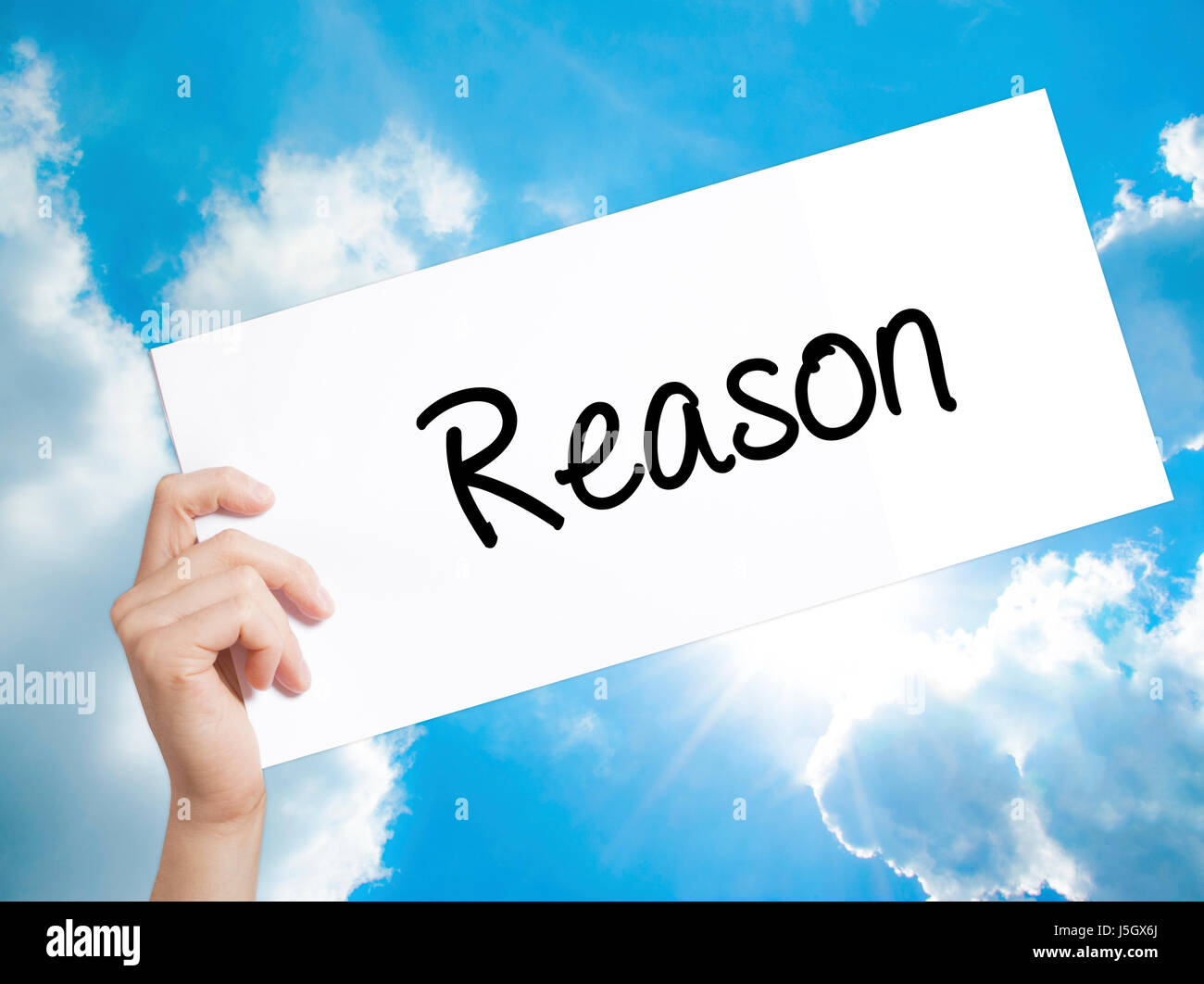 Reason Sign on white paper. Man Hand Holding Paper with text. Isolated ...