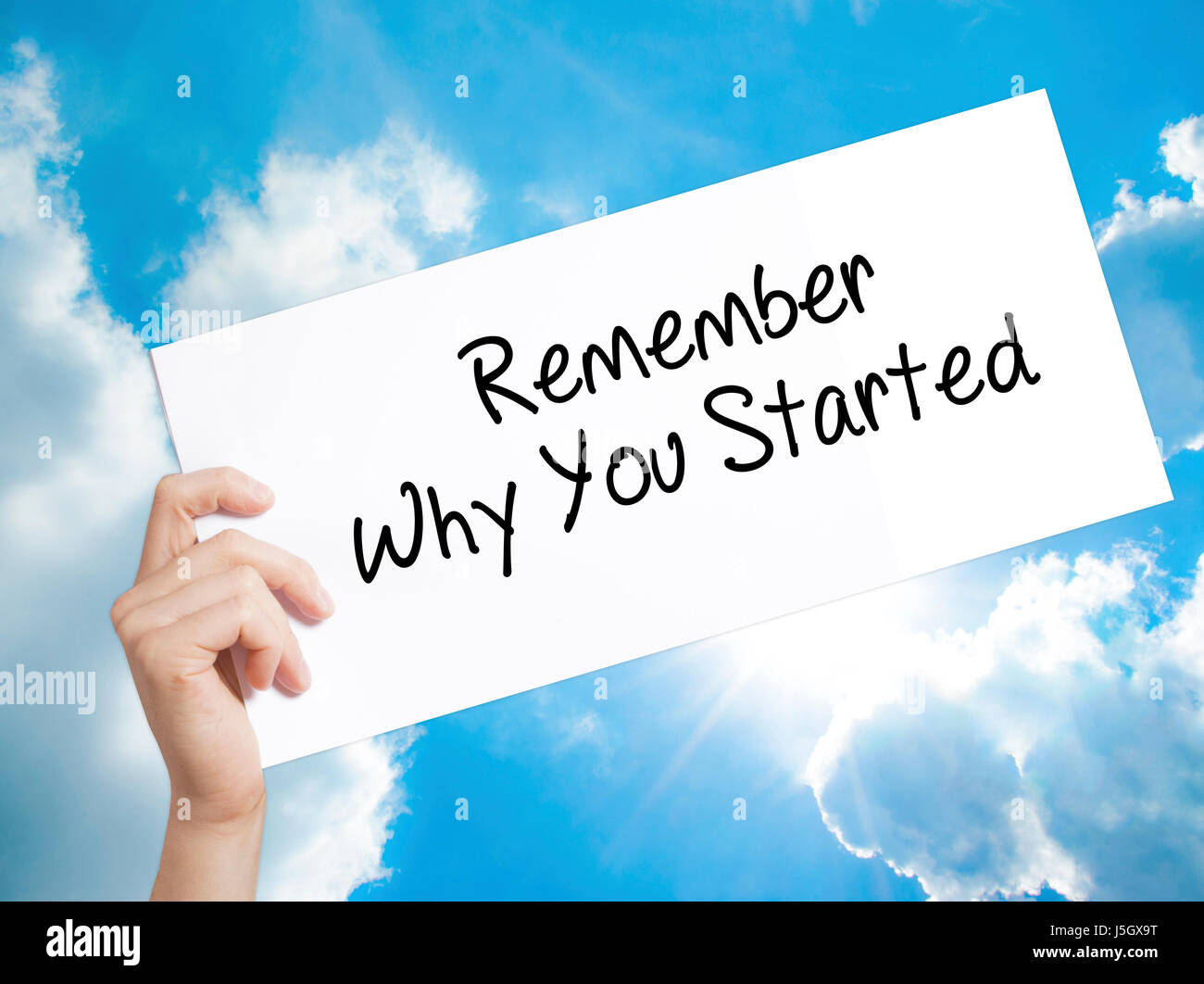 Remember Why You Started Sign on white paper. Man Hand Holding Paper ...
