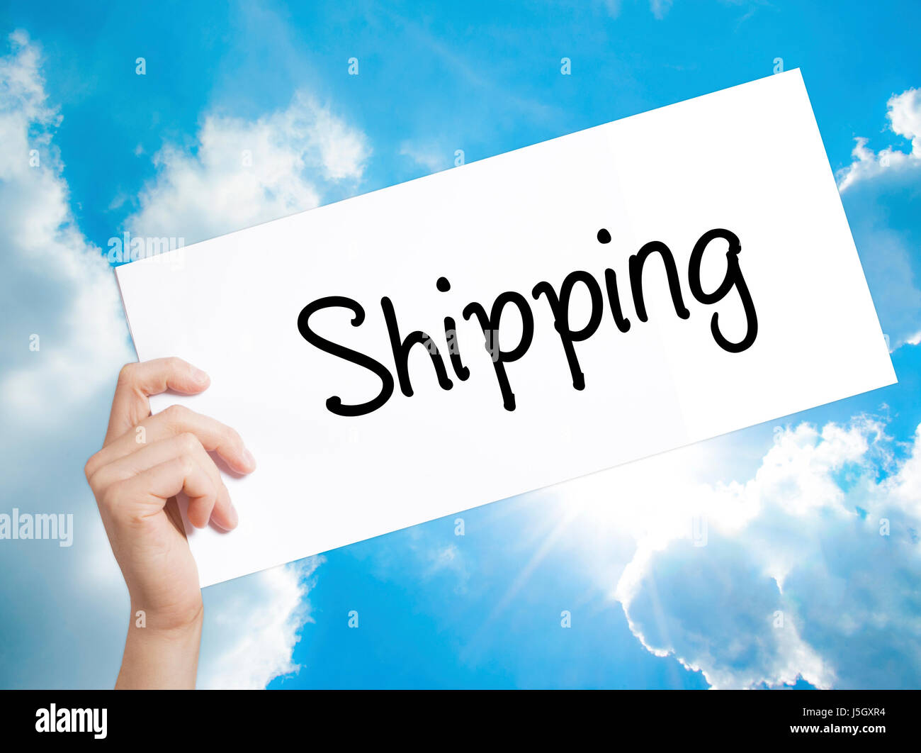 Shipping Sign on white paper. Man Hand Holding Paper with text ...