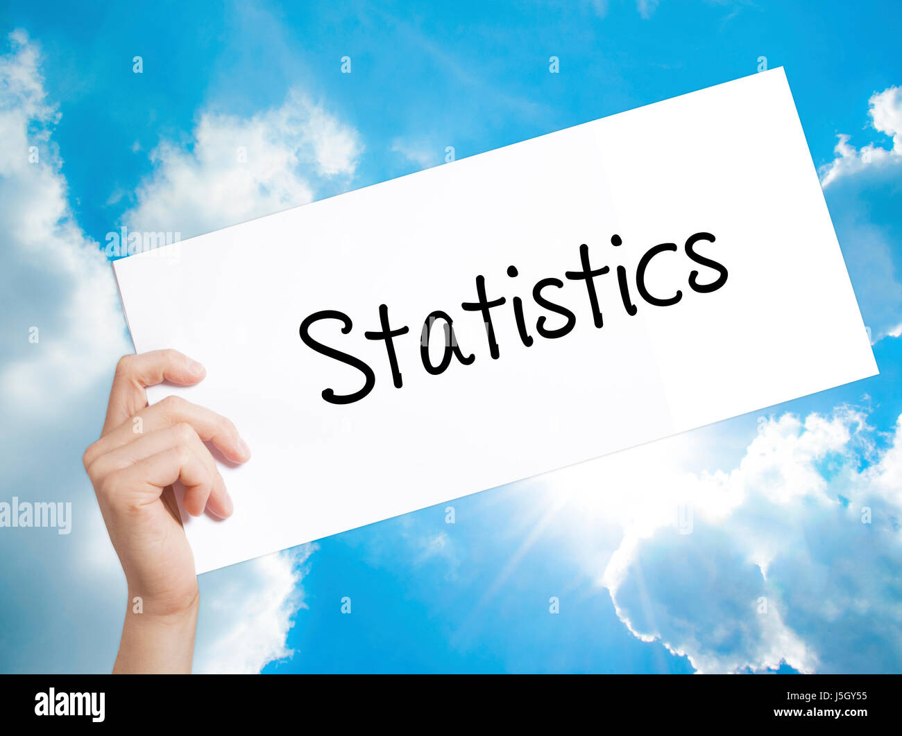 Statistics Sign on white paper. Man Hand Holding Paper with text ...