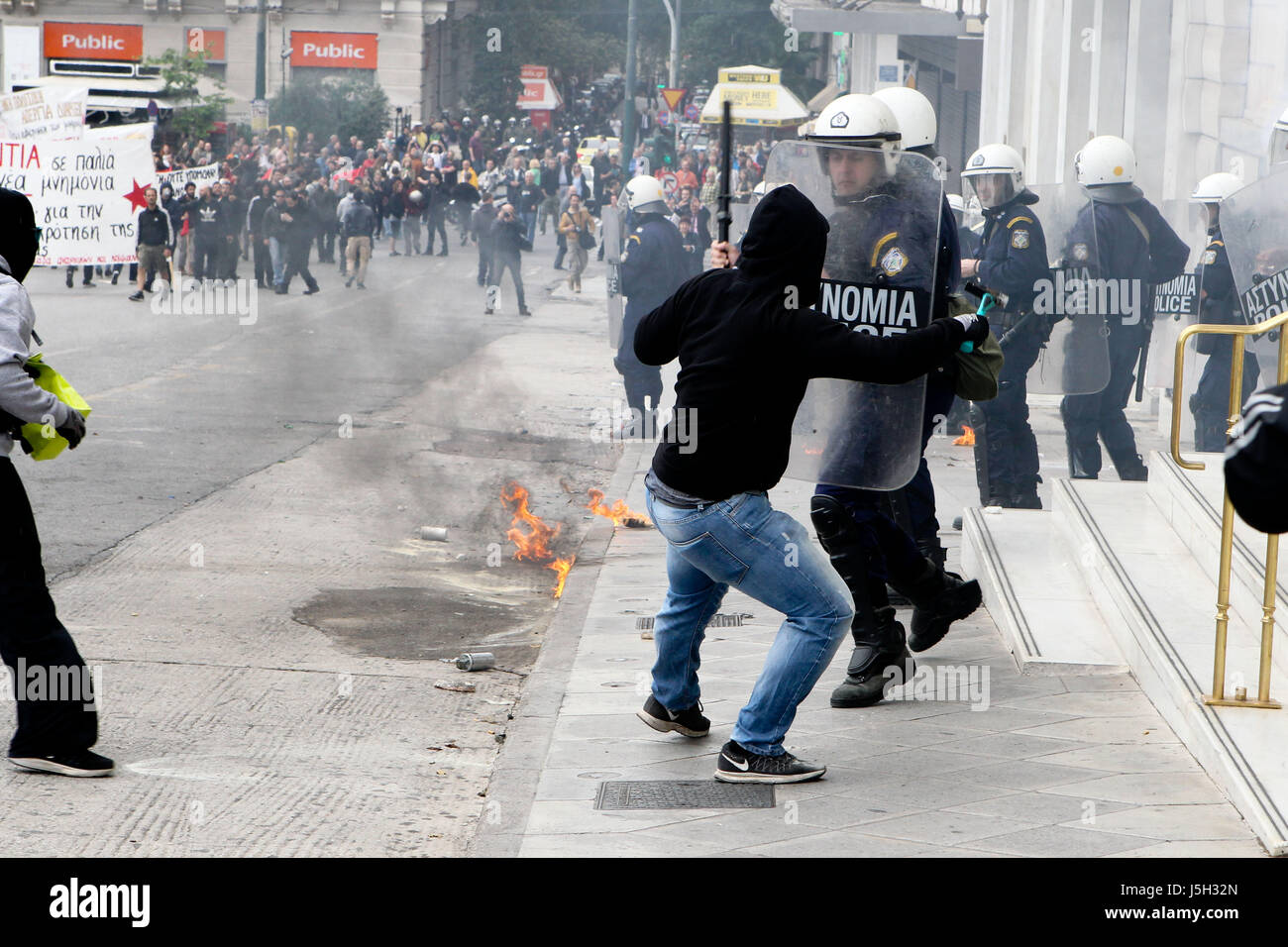 Athens, Greece. 17th May, 2017. A protester attacks with a hammer to a ...