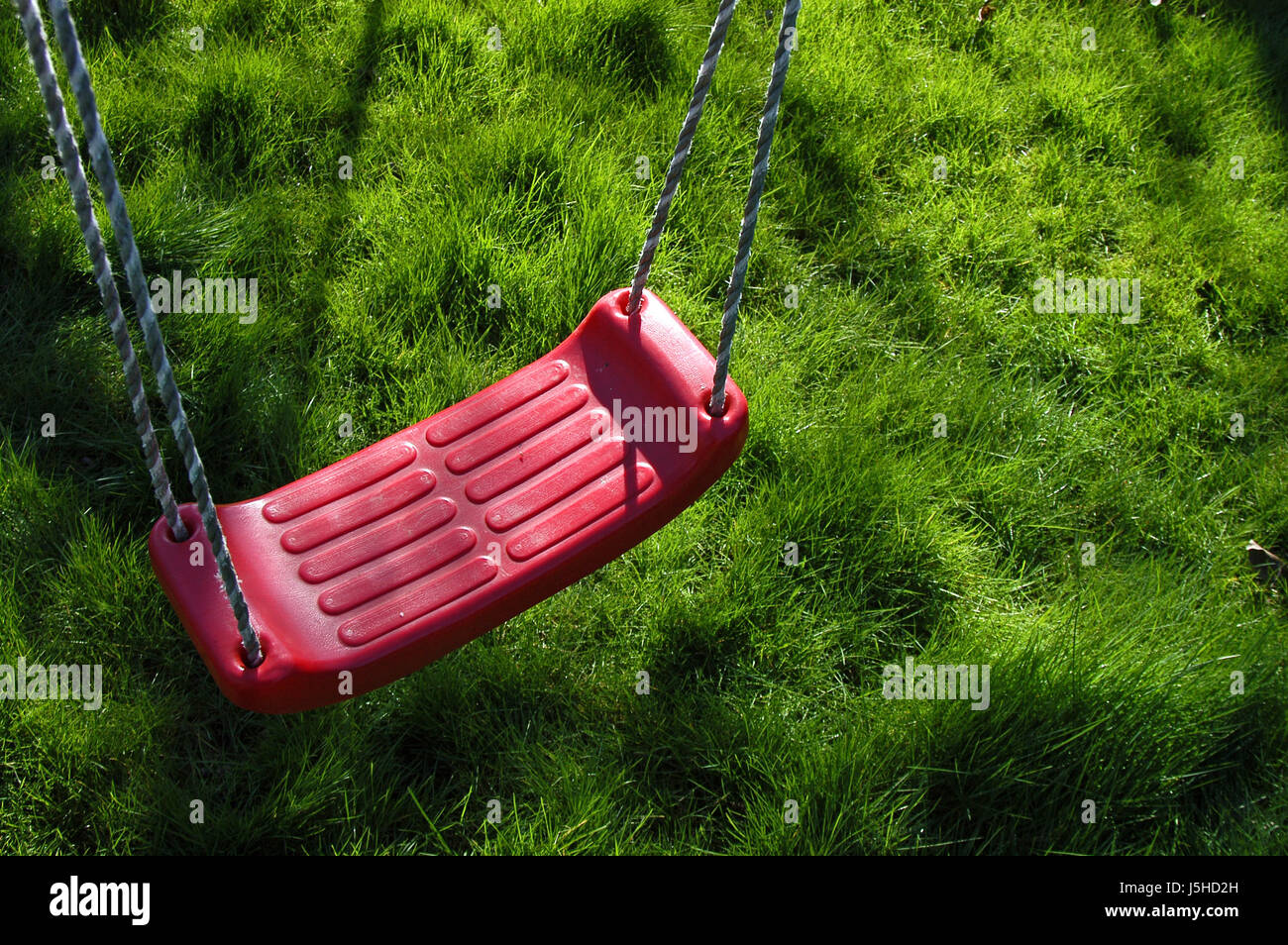 the red swing Stock Photo - Alamy