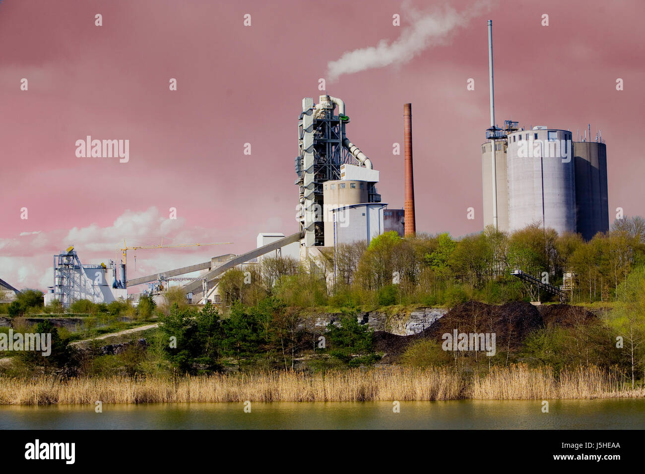 factory buildings by the river Stock Photo - Alamy
