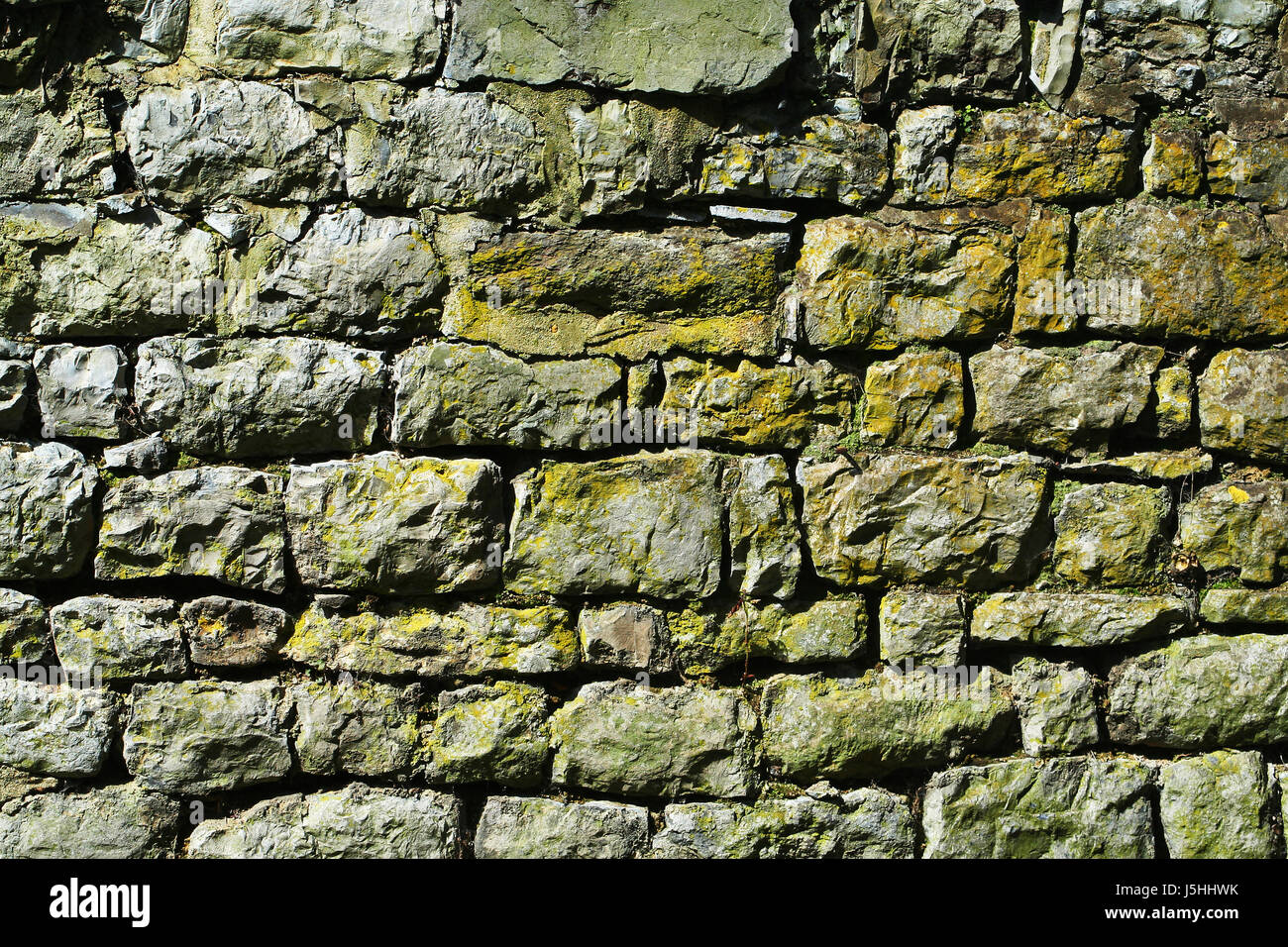 historical wall limestone fortification medieval mossy rubble backdrop ...