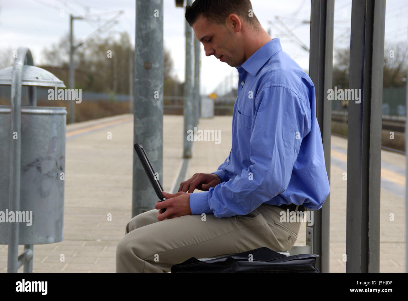 wait waiting station laptop notebook computers computer tracks jeans ...