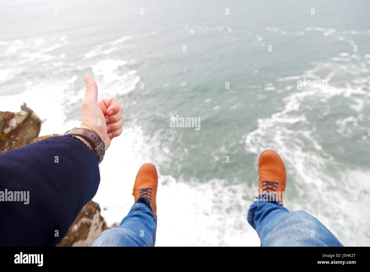 Traveler legs on the top of the mountain Stock Photo - Alamy
