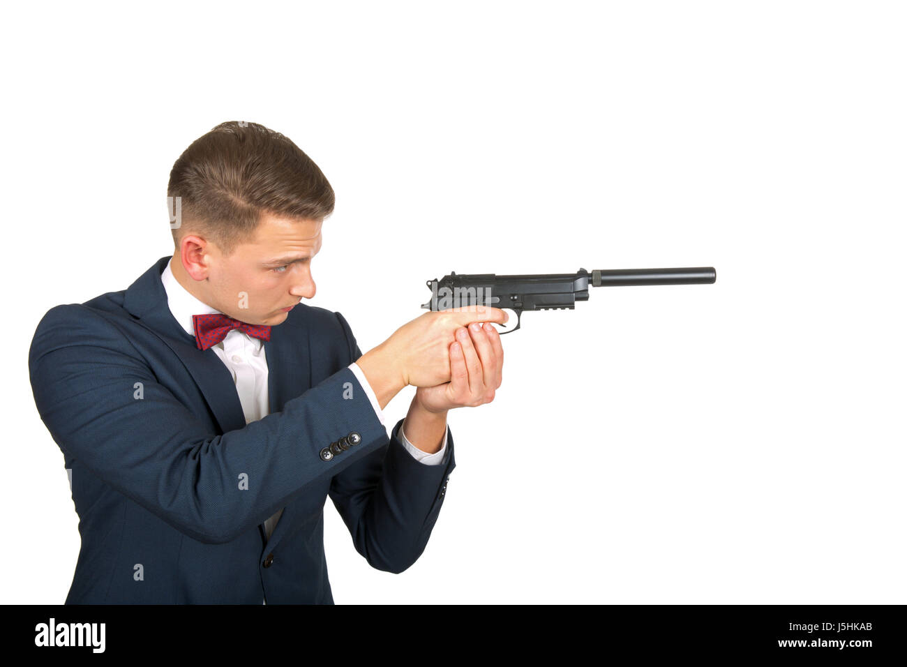Confident businessman pointing a gun on isolated background Stock Photo ... Confident businessman pointing a gun on isolated background Stock Photo ...