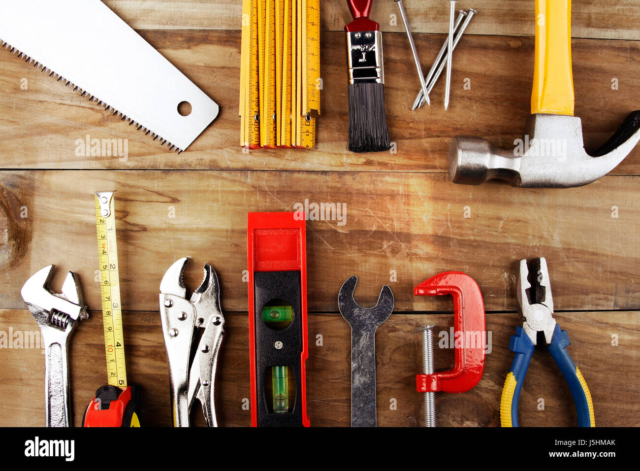 Assorted work tools on wood Stock Photo - Alamy