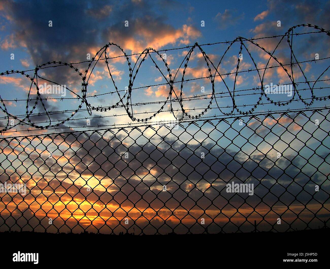 sunrise dramatic art counter-light berlin fence twilight red sky ...