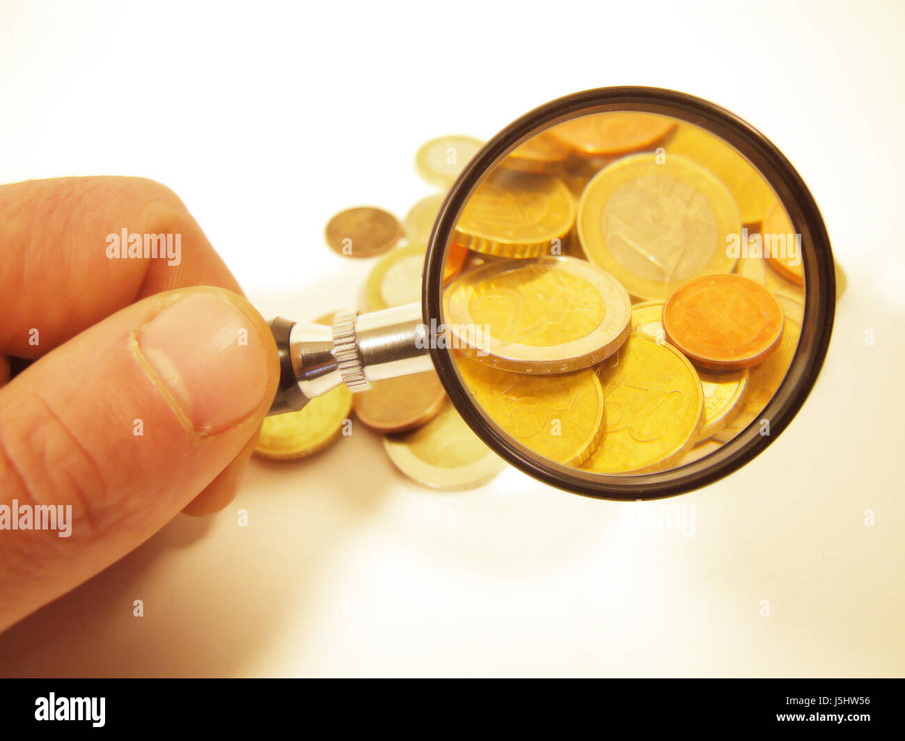 money under the magnifying glass Stock Photo - Alamy