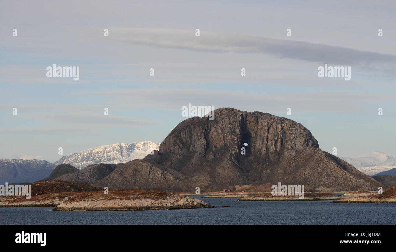 Torghatten, a granite mountain with a hole through its centre seen from ...