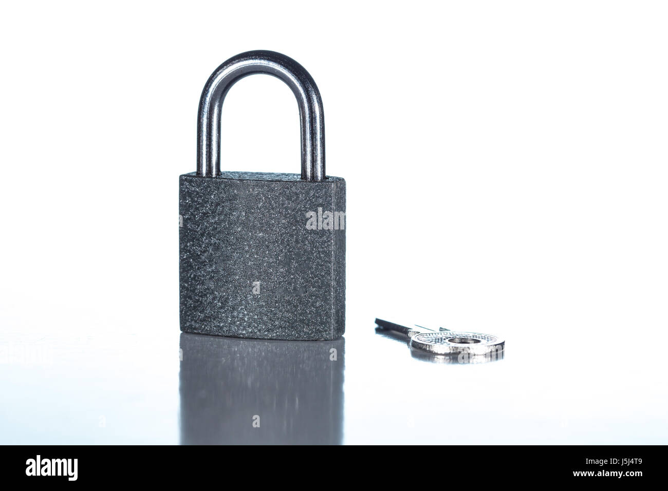 Metallic lock with key isolated on white background Stock Photo - Alamy