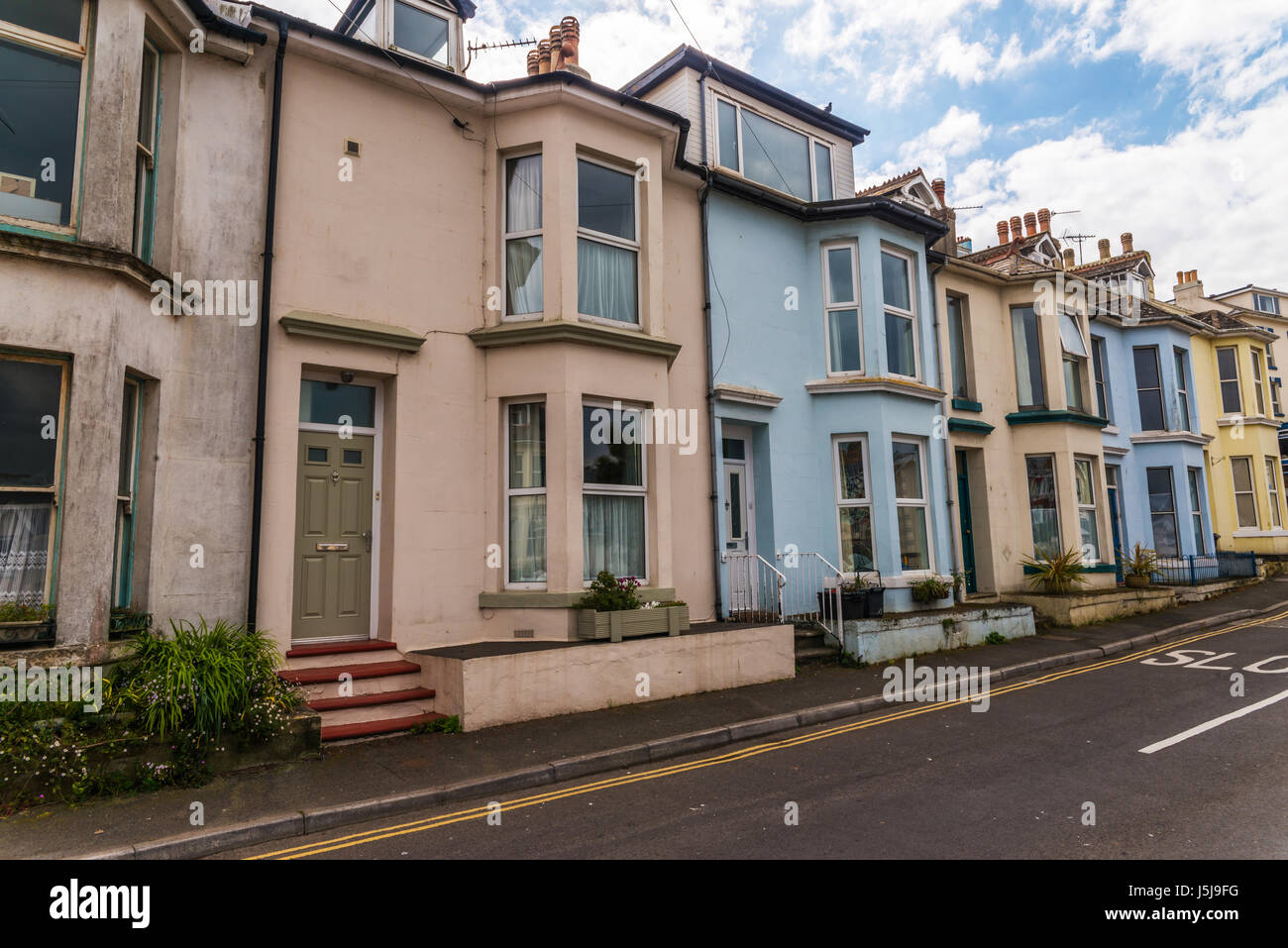 Typical English architecture, residential buildings in a row along the ...