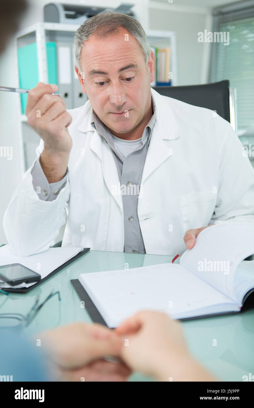 reading the notes Stock Photo - Alamy