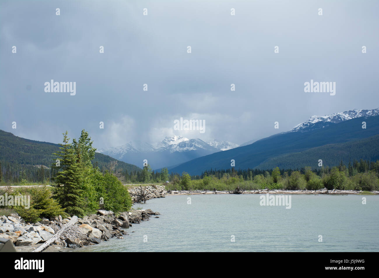 Misty Mountains Over Lake Stock Photo - Alamy