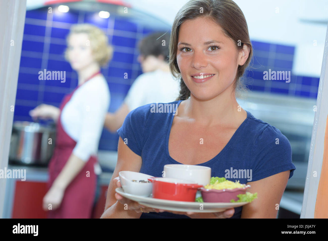 waitress in restaurant Stock Photo - Alamy