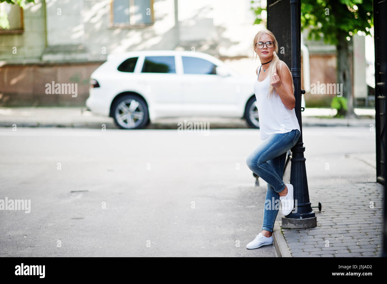Stylish Blonde Woman Wear At Jeans Glasses Choker And White Shirt