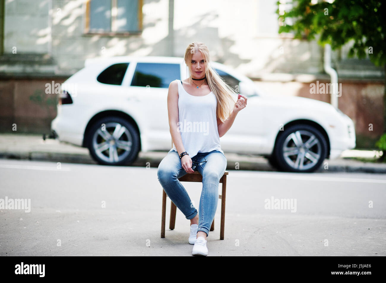 Stylish Blonde Woman Wear At Jeans Glasses Choker And White Shirt