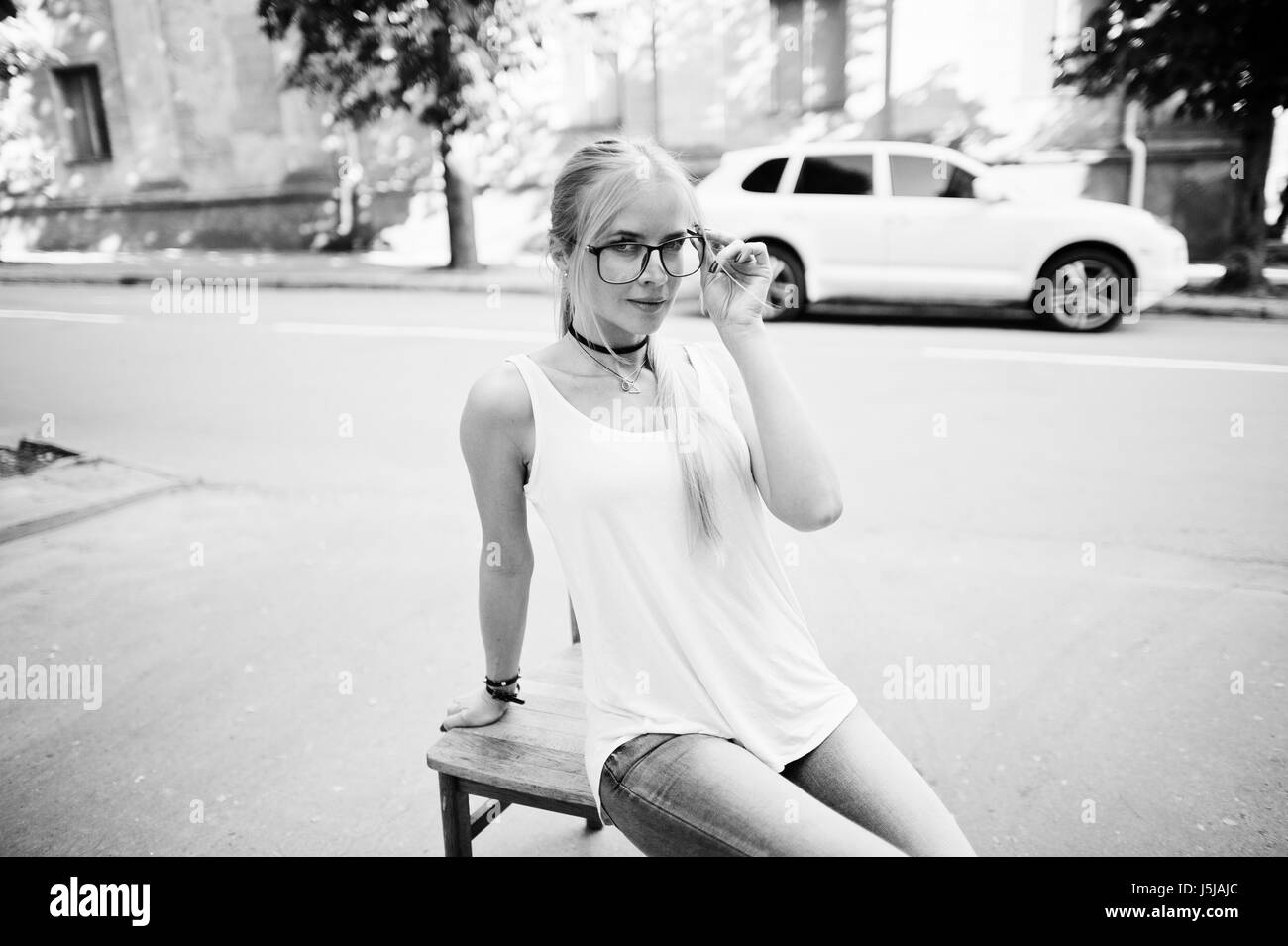 Stylish Blonde Woman Wear At Jeans Glasses Choker And White Shirt