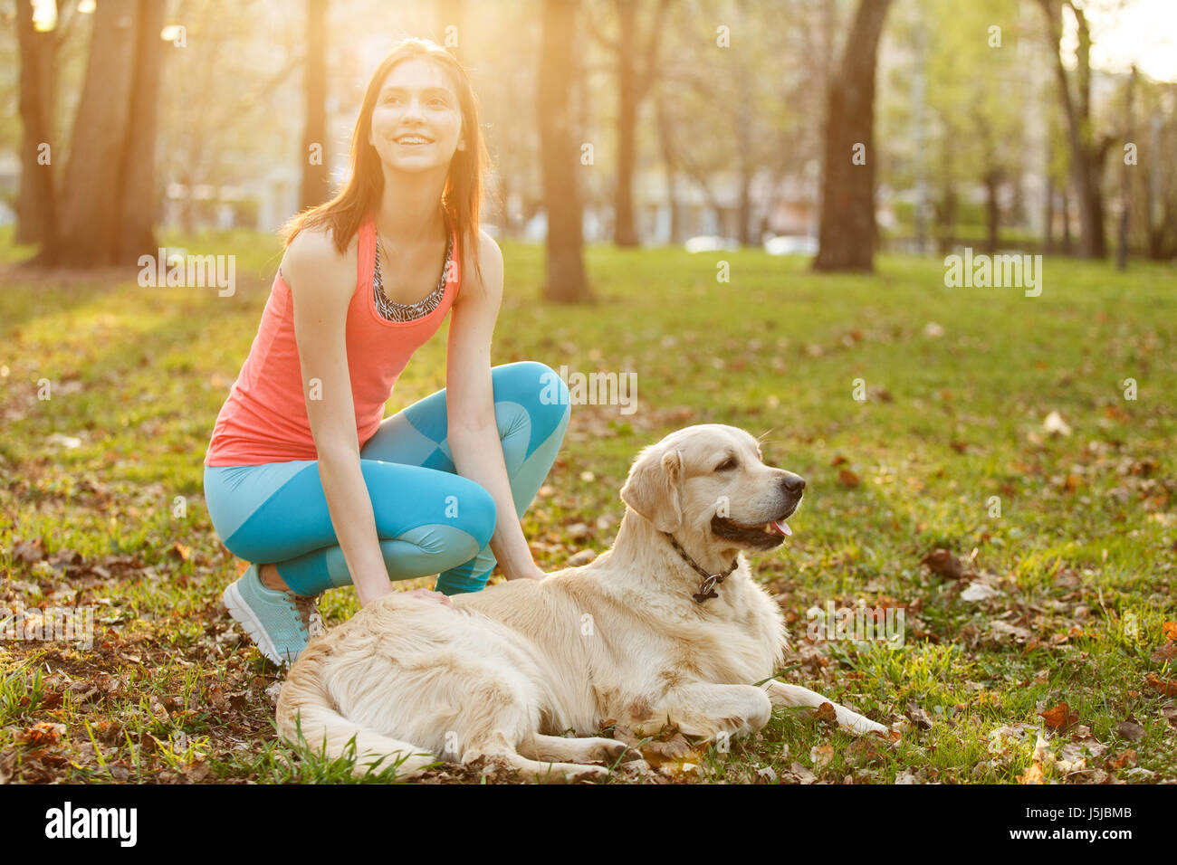 Woman with labrador on walk Stock Photo - Alamy