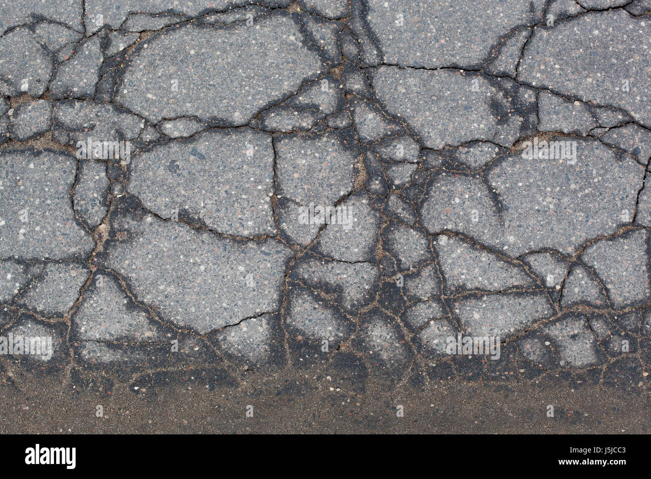 Bad condition car road with the part of the ground Stock Photo - Alamy