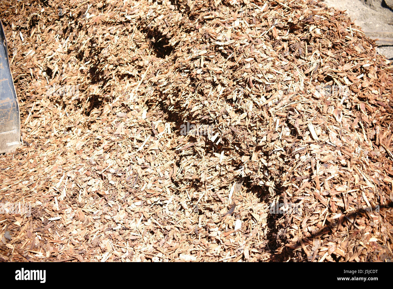 The close-up of a peat bunch with shredded wood splinters Stock Photo ...