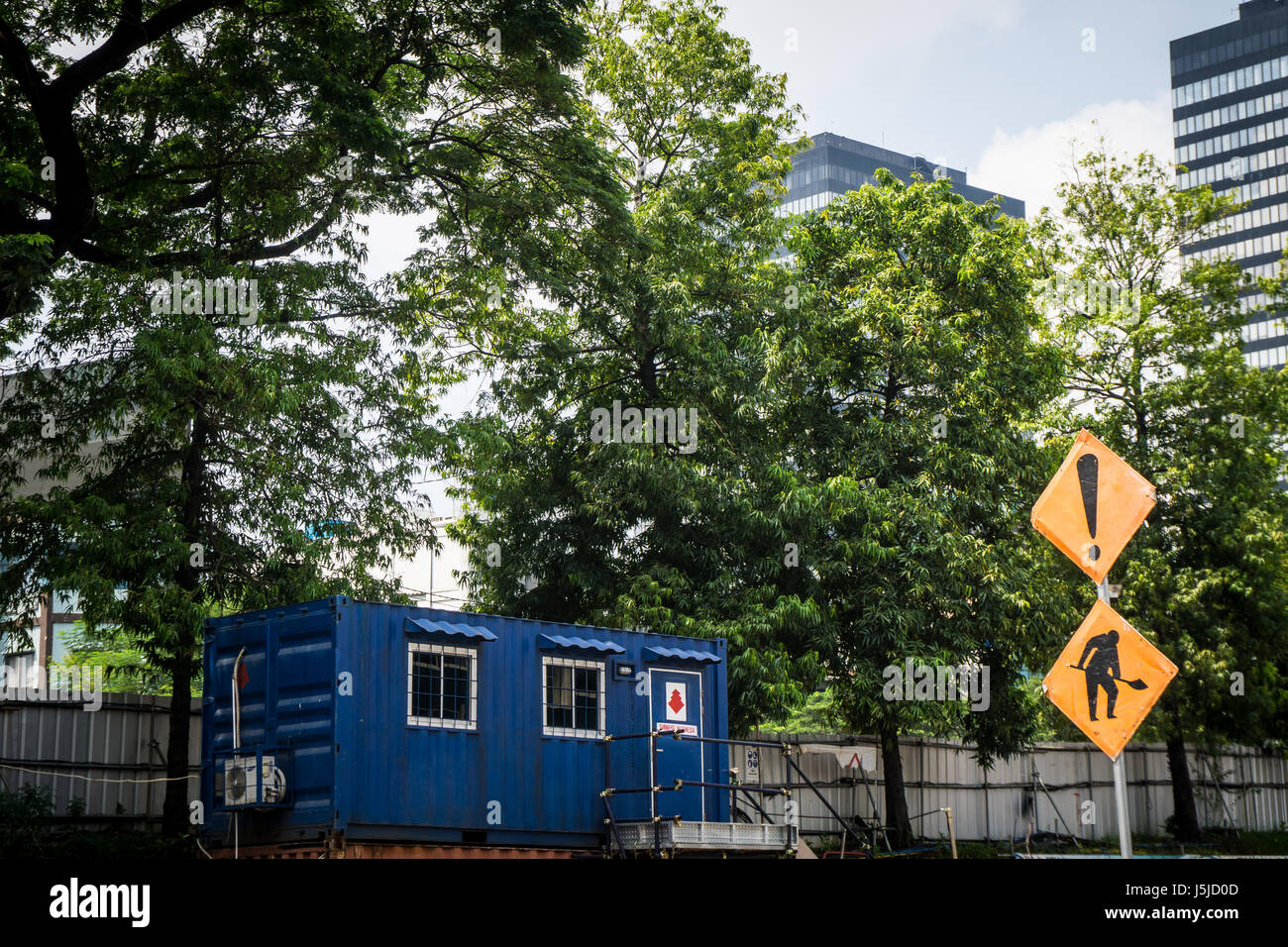 blue container house as office or house with green tree as background ...