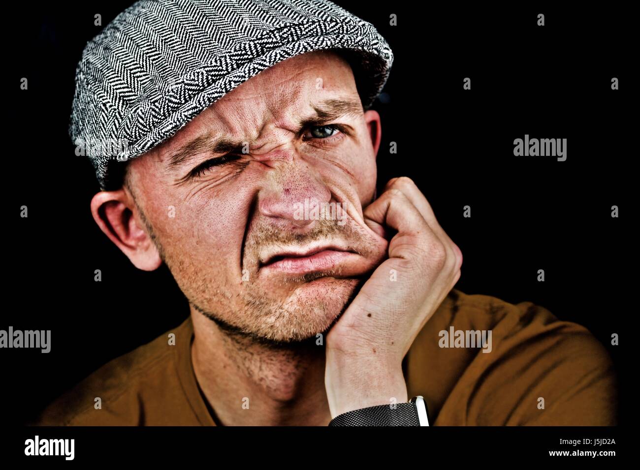 Face hand sad grey hi-res stock photography and images - Alamy