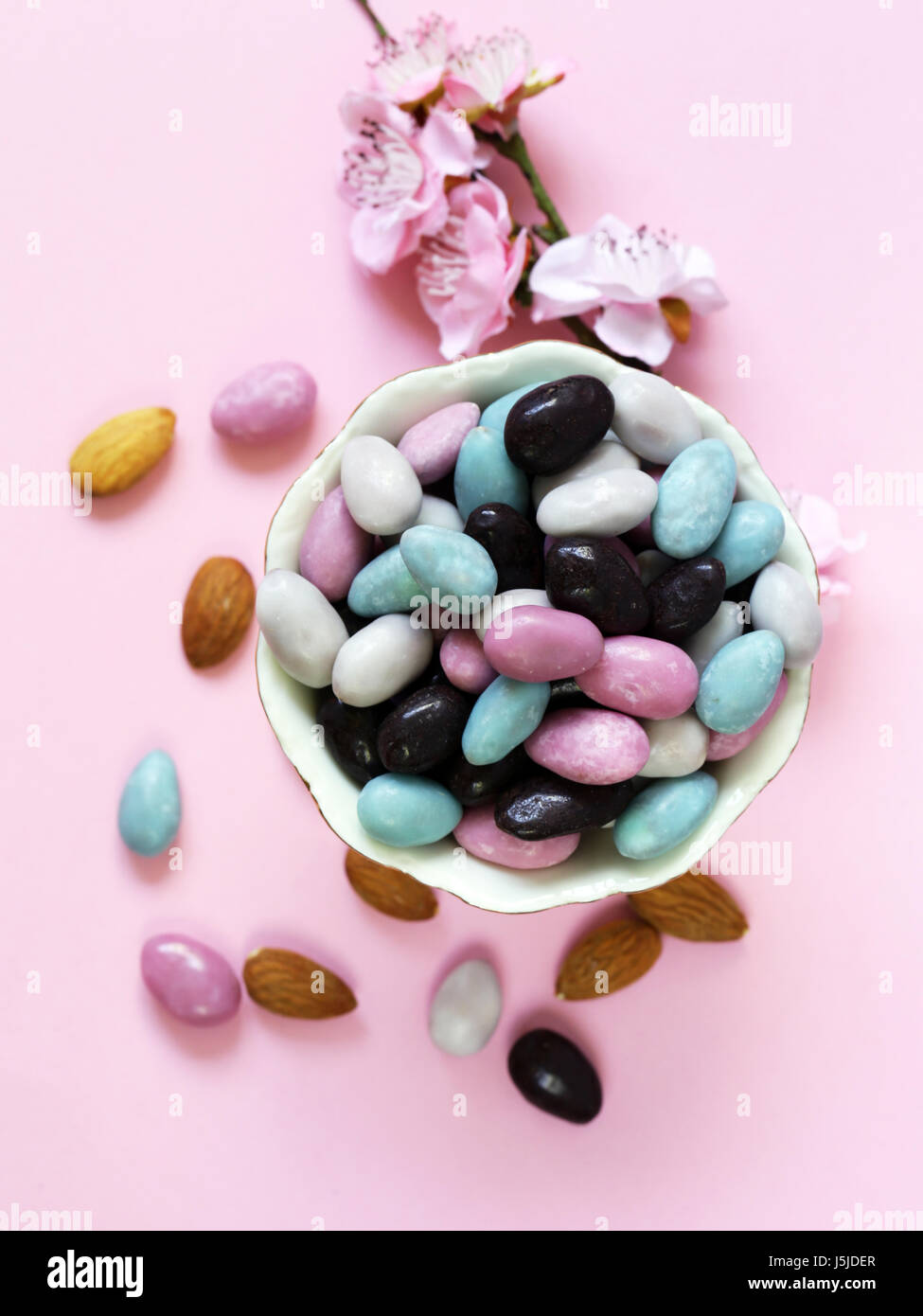 Candies almonds in sugar colored glaze Stock Photo - Alamy