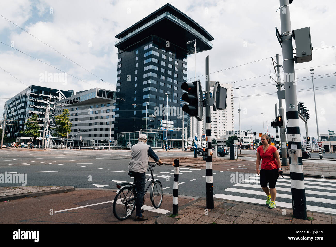 Rottedam, The Netherlands - August 6, 2016: People crossing the street ...