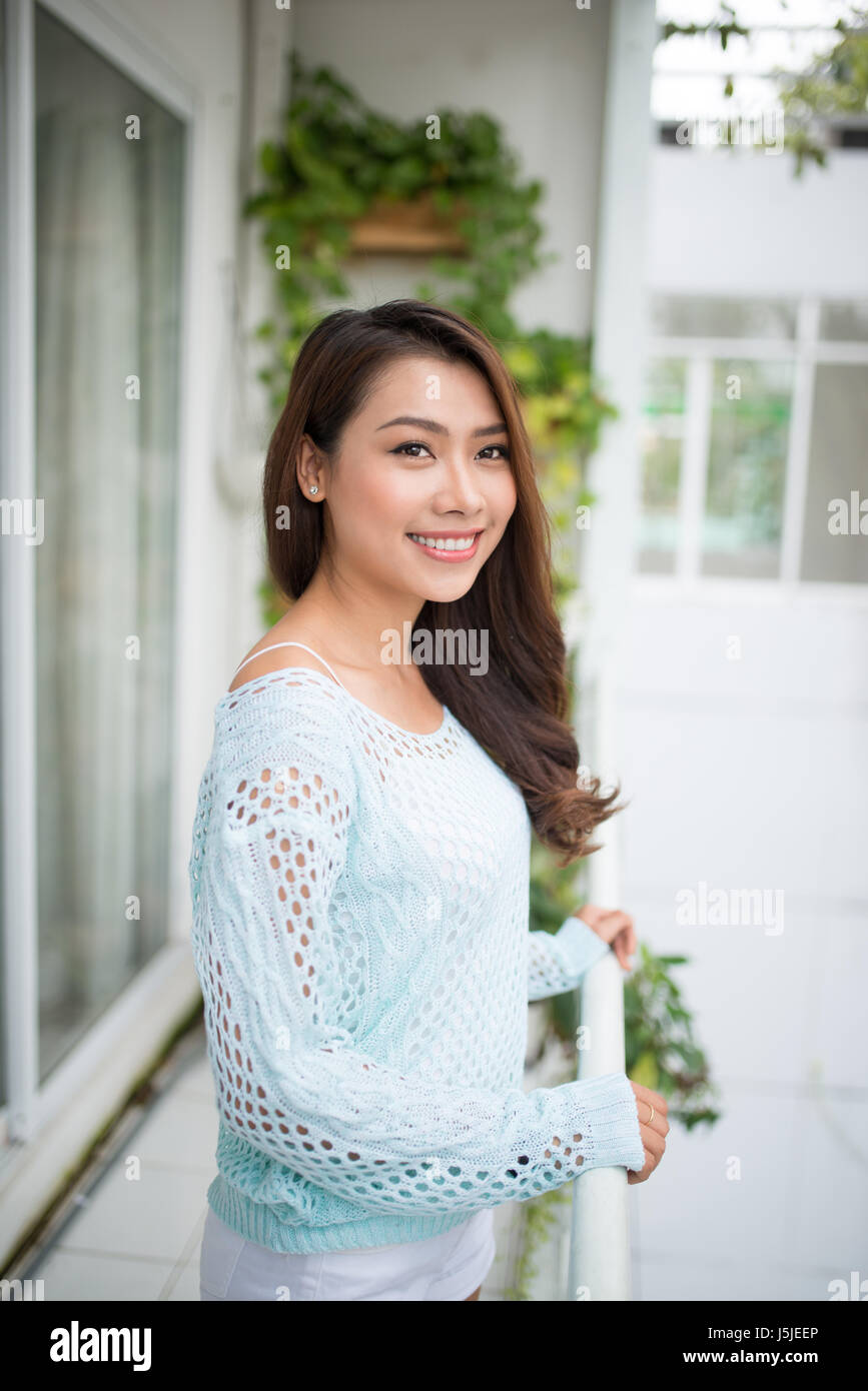 Asian woman enjoying fresh air at home Stock Photo - Alamy
