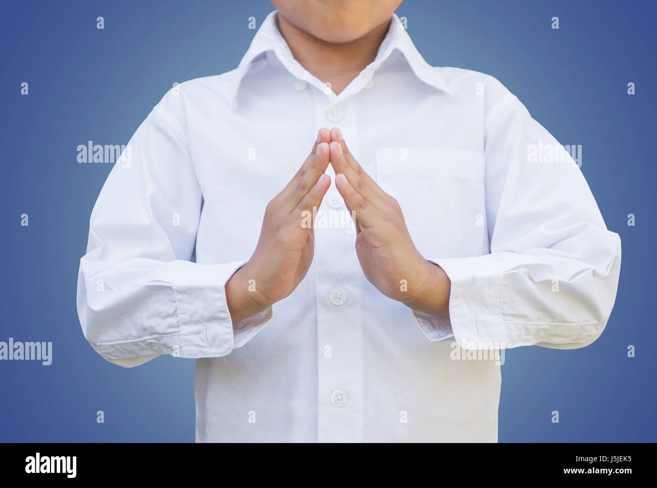 Boy child praying action with clipping path Stock Photo - Alamy