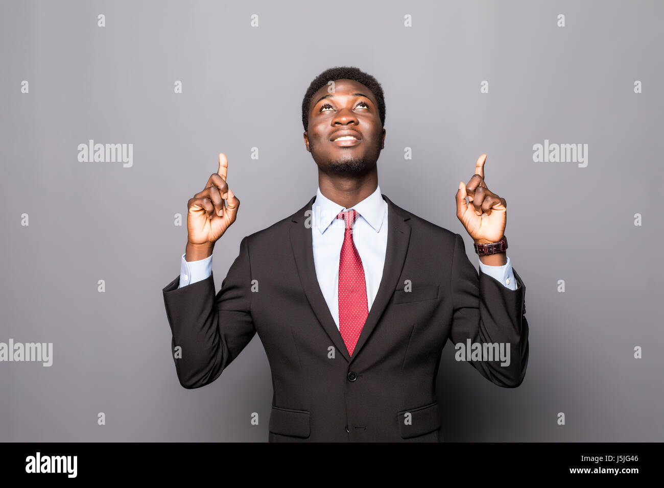 Black business man pointing up isolated over white background Stock ...