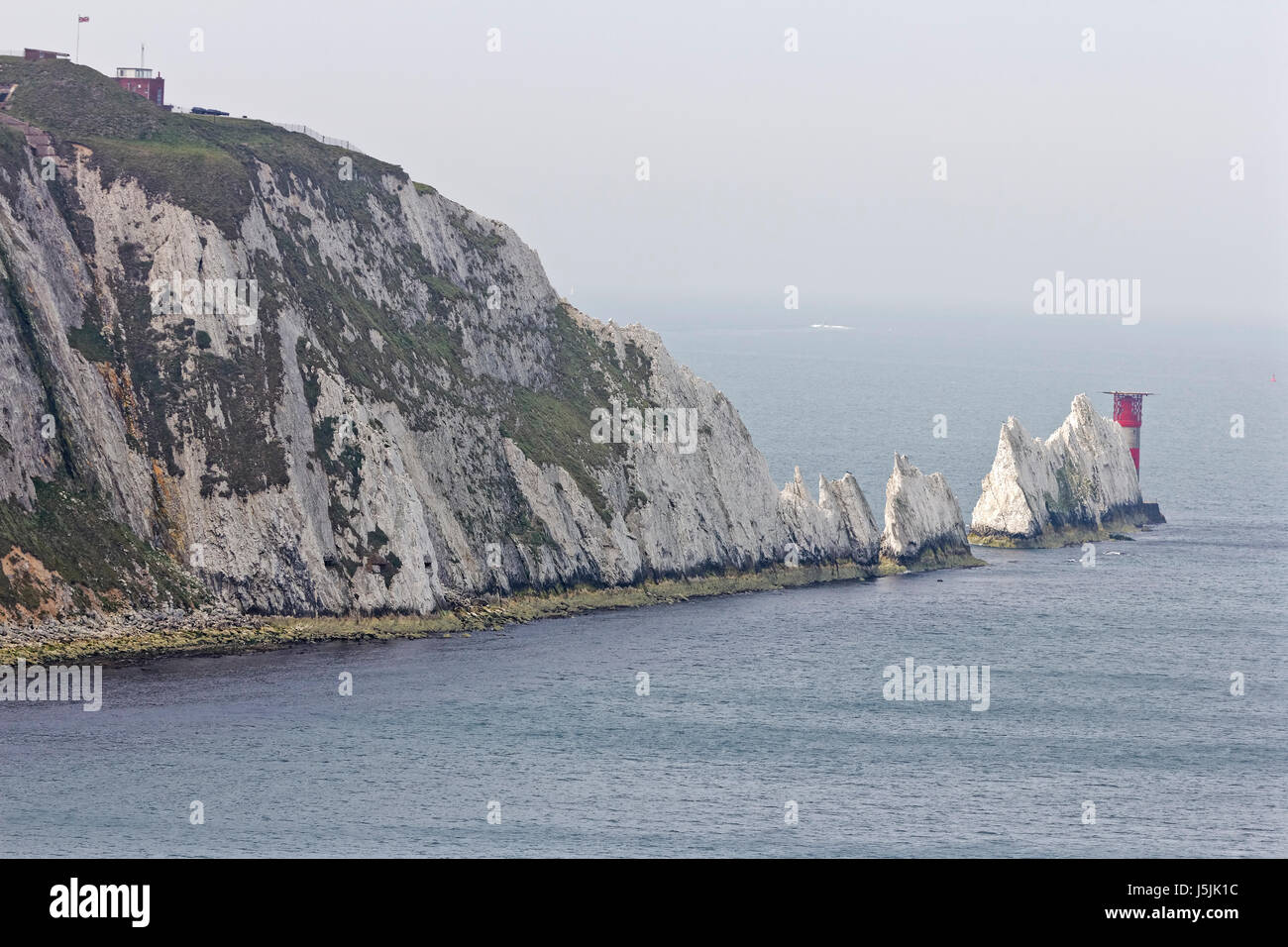 The white chalk cliffs, the Needles and Trinity Lighthouse on a hazy ...