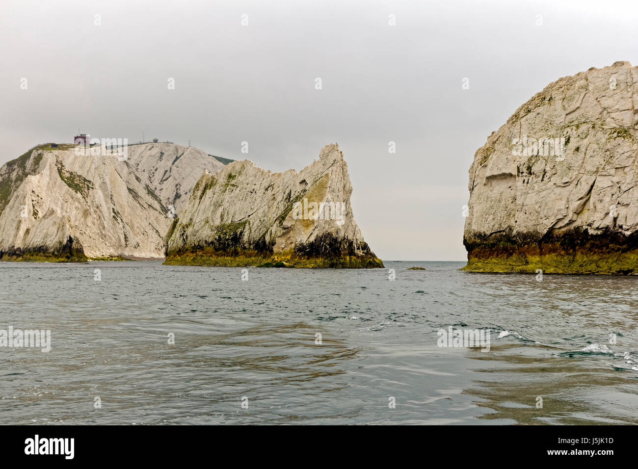 The chalk cliffs of High Down, and the Needles rock formation on the ...